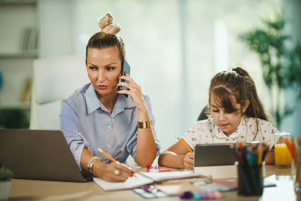 Little Girl Having Breakfast While Overworked Mother Phoning Checking ...
