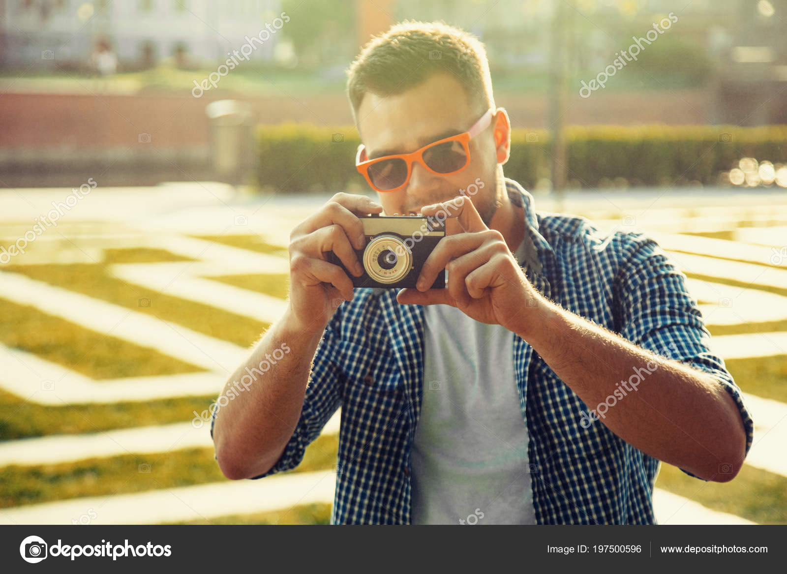 Young man with camera at outdoor — Stock Photo © massonforstock #197500596