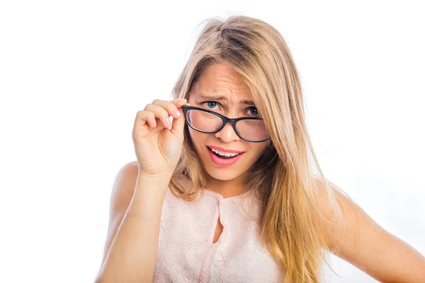 Young beautiful blonde woman holding both hands on her head, exposing ...