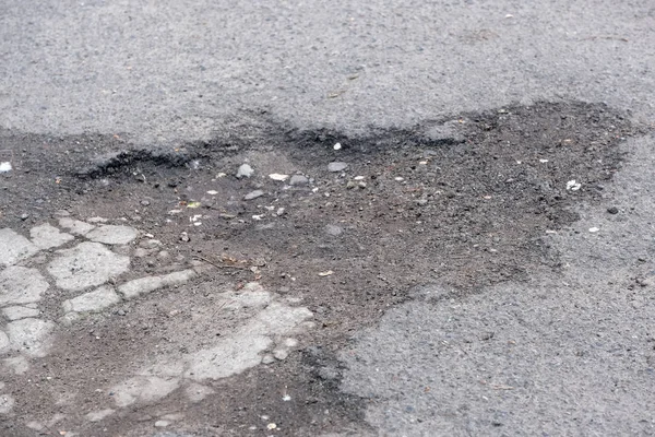 Destroyed asphalt pavement — Stock Photo © Aviavlad3 #313582998