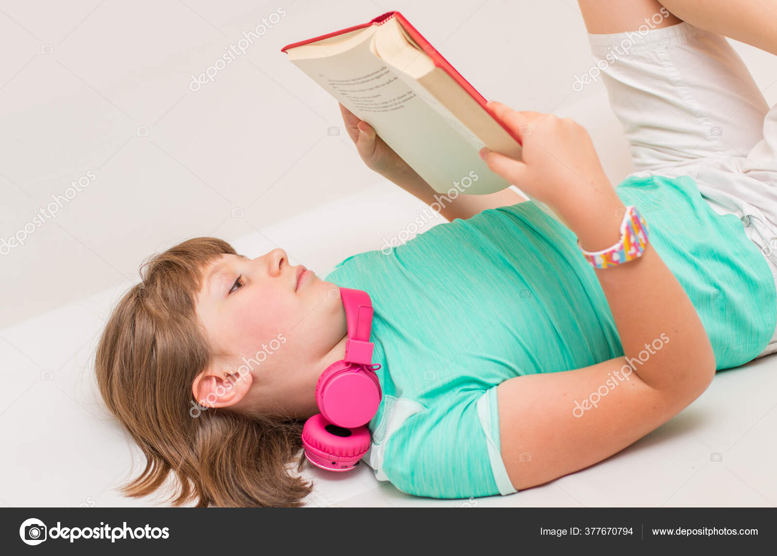 Young Girl Child Reading Book Sofa Home — Stock Photo © lsantilli ...