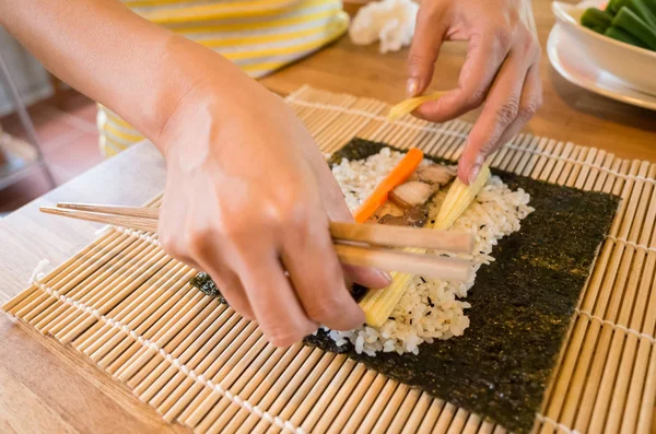prepare and make homemade sushi on the table at home - Stock Image ...