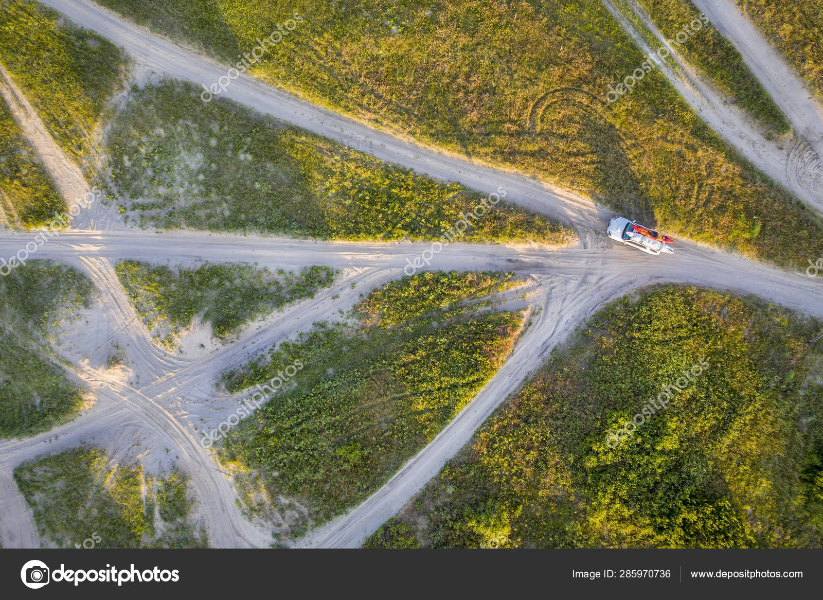 SUV on sandy trails aerial view Stock Photo by ©PixelsAway 285970736