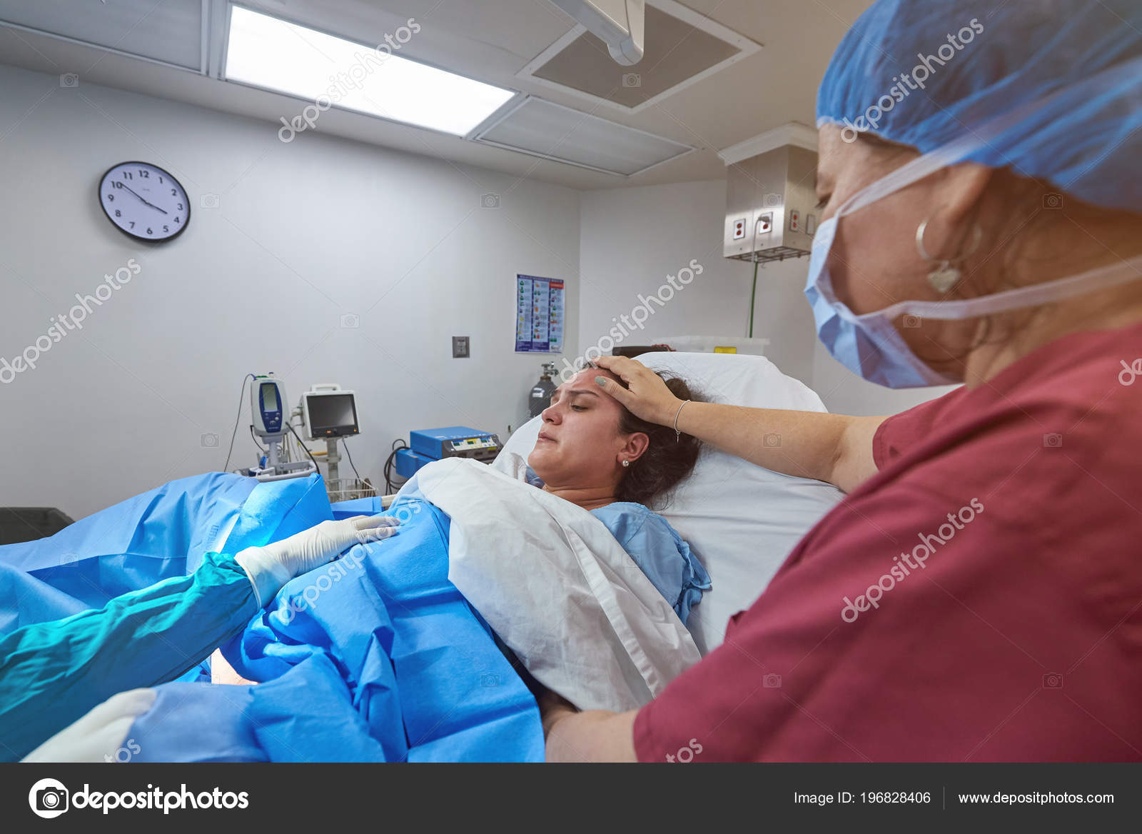 Nurse helping in baby delivery Stock Photo by ©dimarik 196828406