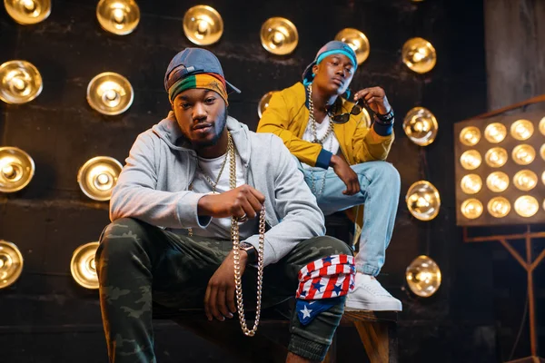 Black Rapper Cap Sitting Steps Singer Stage Spotlights Background Rap ...