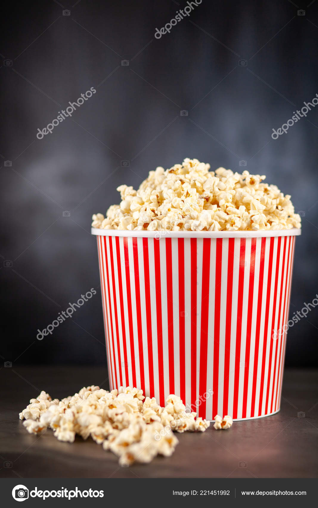 Full popcorn bucket Stock Photo by ©gdolgikh 221451992