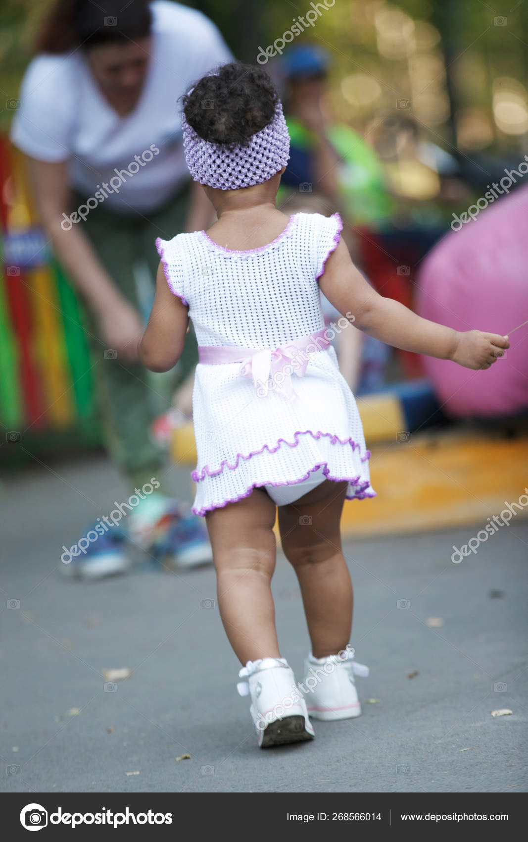 Cute girl walk on park road. Stock Photo by ©vorobevaola 268566014