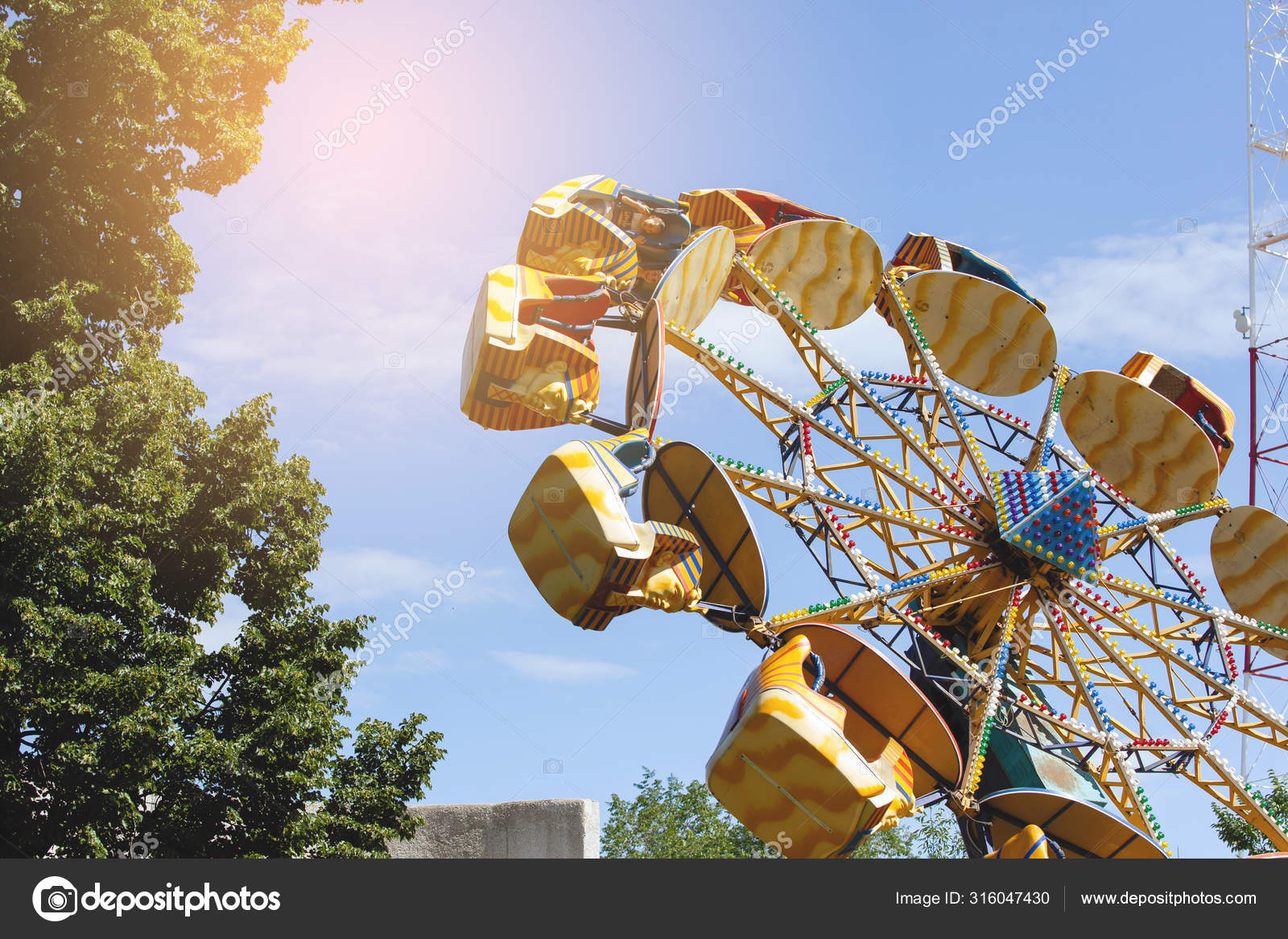 Yellow carousel in a summer city park. — Stock Photo © vorobevaola ...
