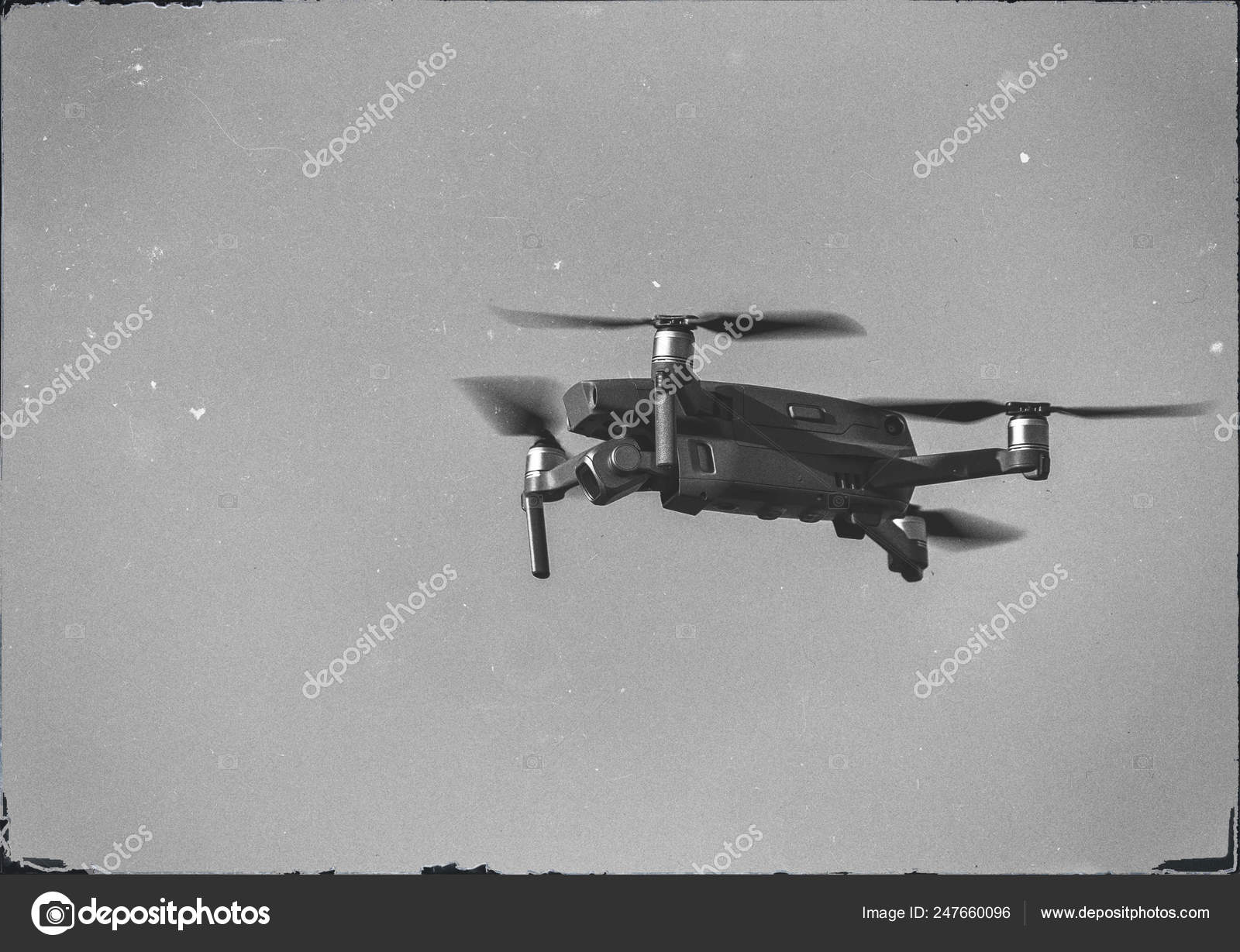 Drone flying overhead against blue sky — Stock Photo © leonardo1 #247660096