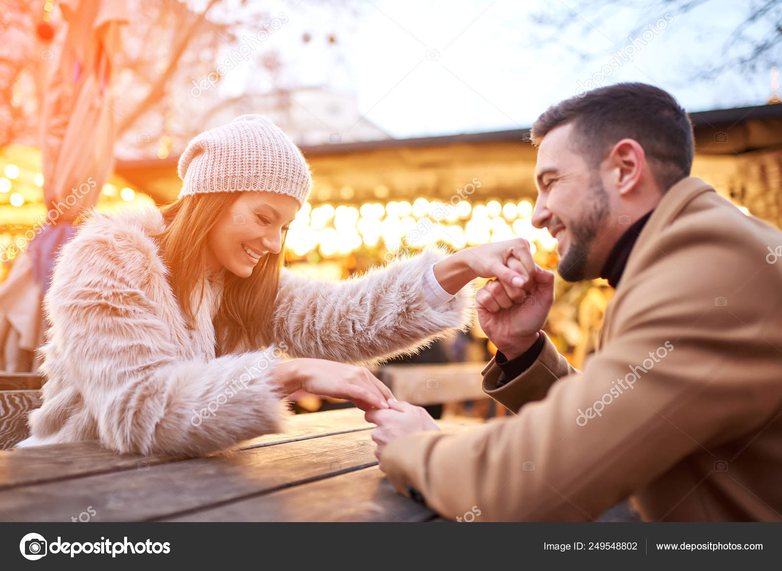 Kissing hands in a christmas market Stock Photo by ©Spectral 249548802