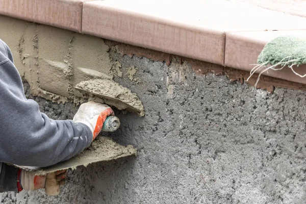 Tile Worker Applying Cement with Trowel at Pool Construction Sit ...