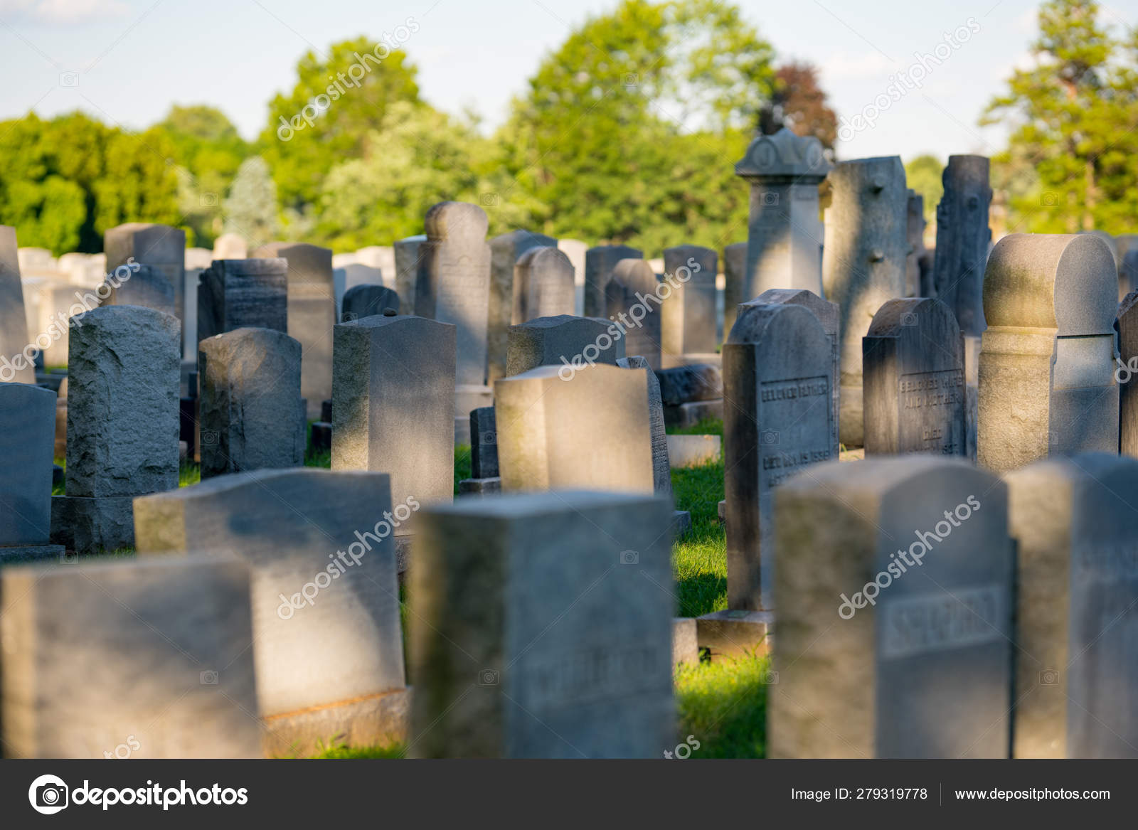 Gravestones at a cemetery shadows from trees — Stock Photo © felixtm ...