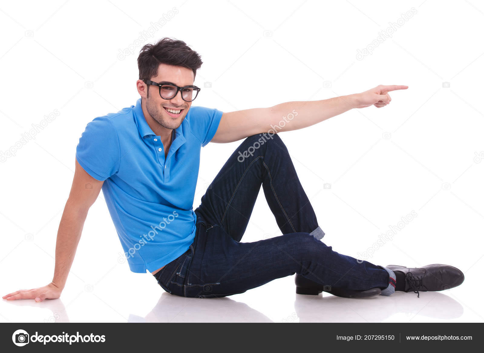 Happy Seated Casual Man Pointing Side While Lying Floor White Stock ...