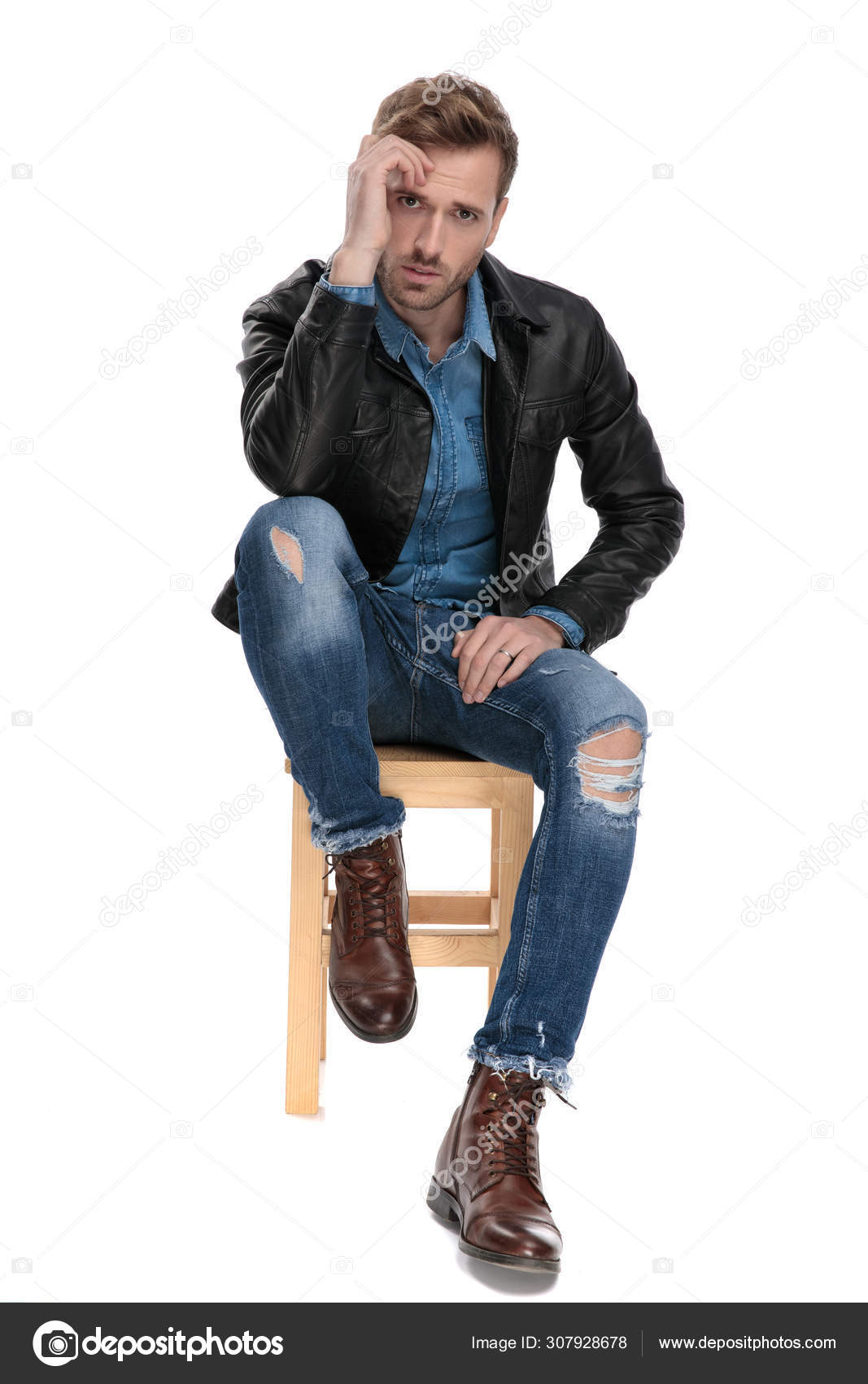 Man sitting with one hand on forehead — Stock Photo © feedough #307928678
