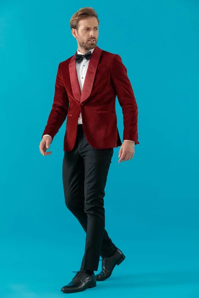 Happy young fashion model smiling and wearing red velvet tuxedo Stock ...