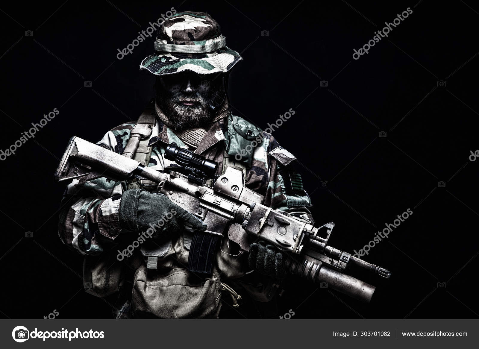 Commando soldier in battle ammunition, armed rifle Stock Photo by ...