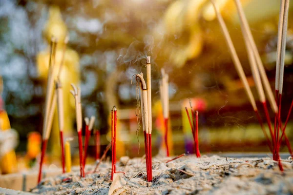 Symbols of Buddhism. Burning incense sticks. South-Eastern Asia ...