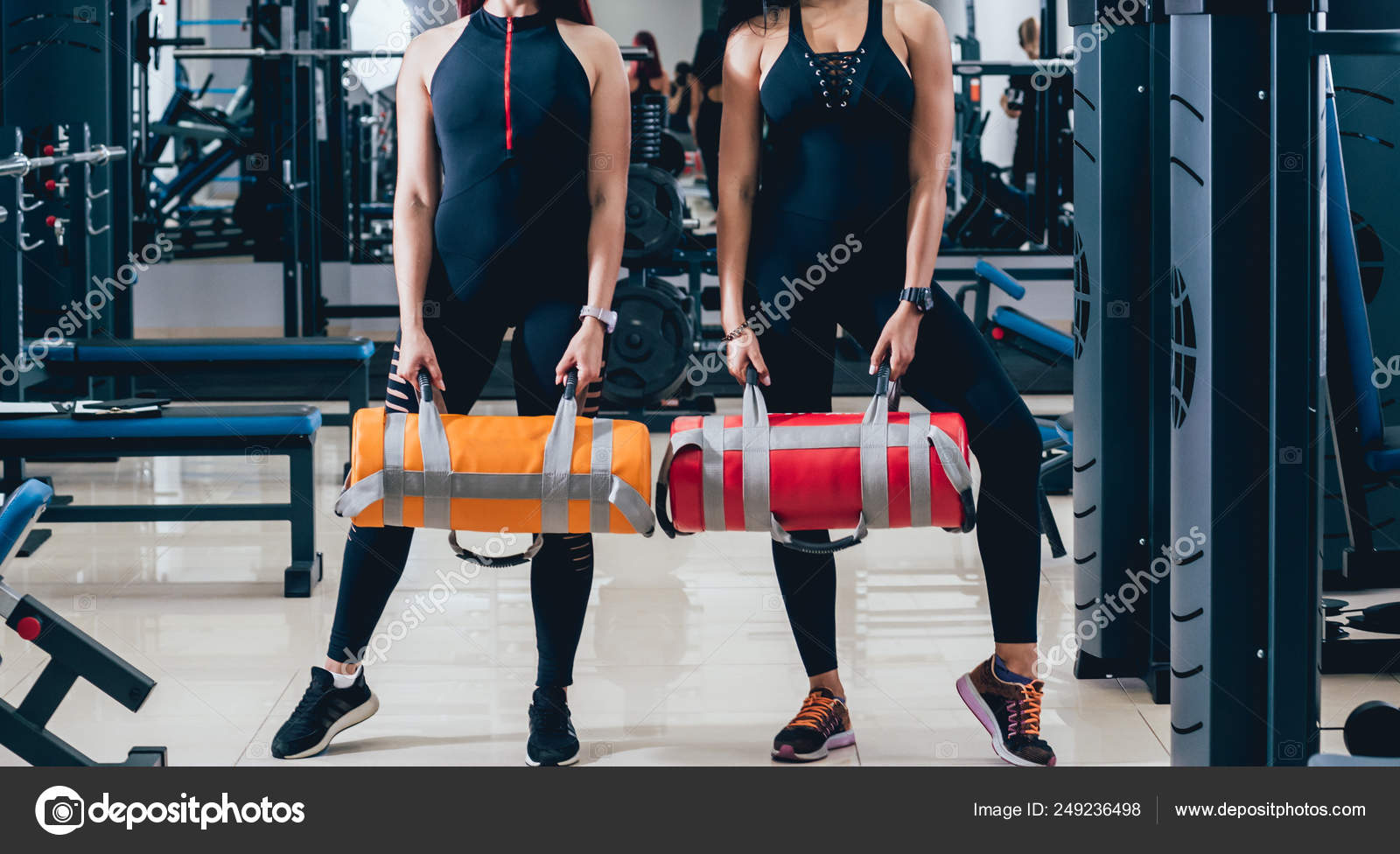 Athletic Young Women Training Sandbags Gray Background Crossfit Center ...