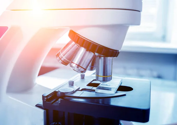 Microscope with metal lens at laboratory. Medical equipment - Stock ...
