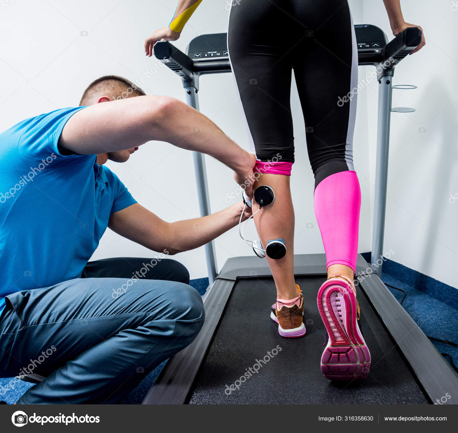Physical Therapist Installing Electrostimulator Muscles Female Legs ...