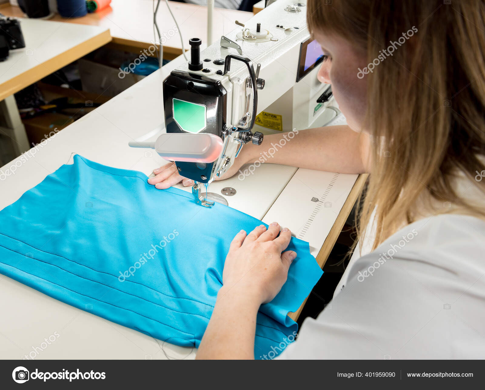 Designer tailor sew the dress. Woman use sewing machine for his work ...