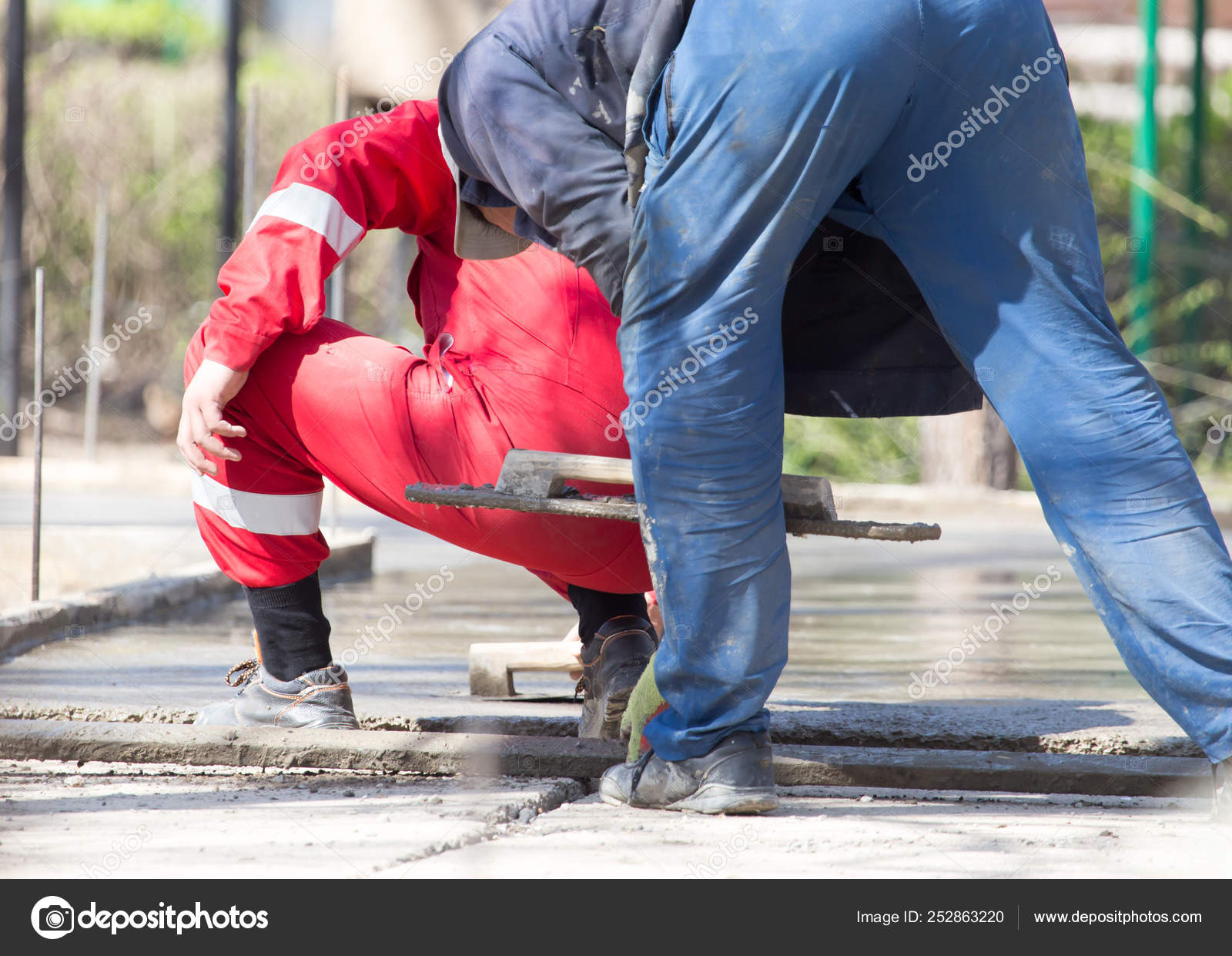 Construction workers leveling concrete pavement. ⬇ Stock Photo, Image ...