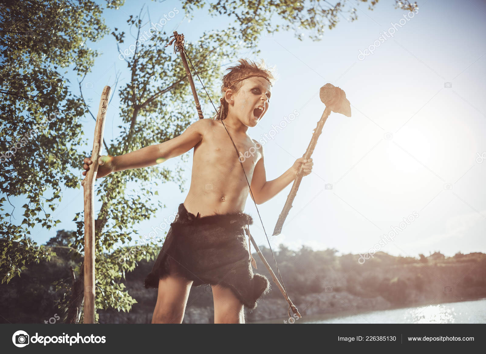 Caveman, manly boy with weapon Stock Photo by ©dimabl 226385130