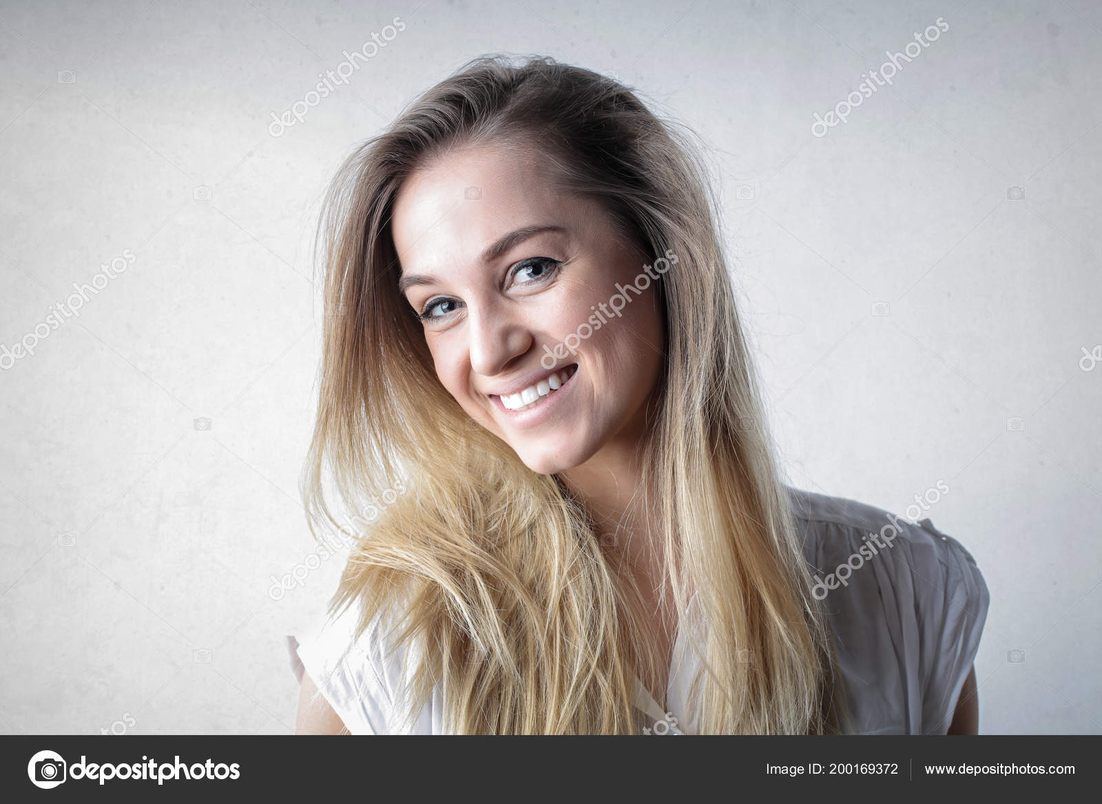 Beautiful Blonde Woman Smiling Happily — Stock Photo © olly18 #200169372 Beautiful Blonde Woman Smiling Happily — Stock Photo © olly18 #200169372