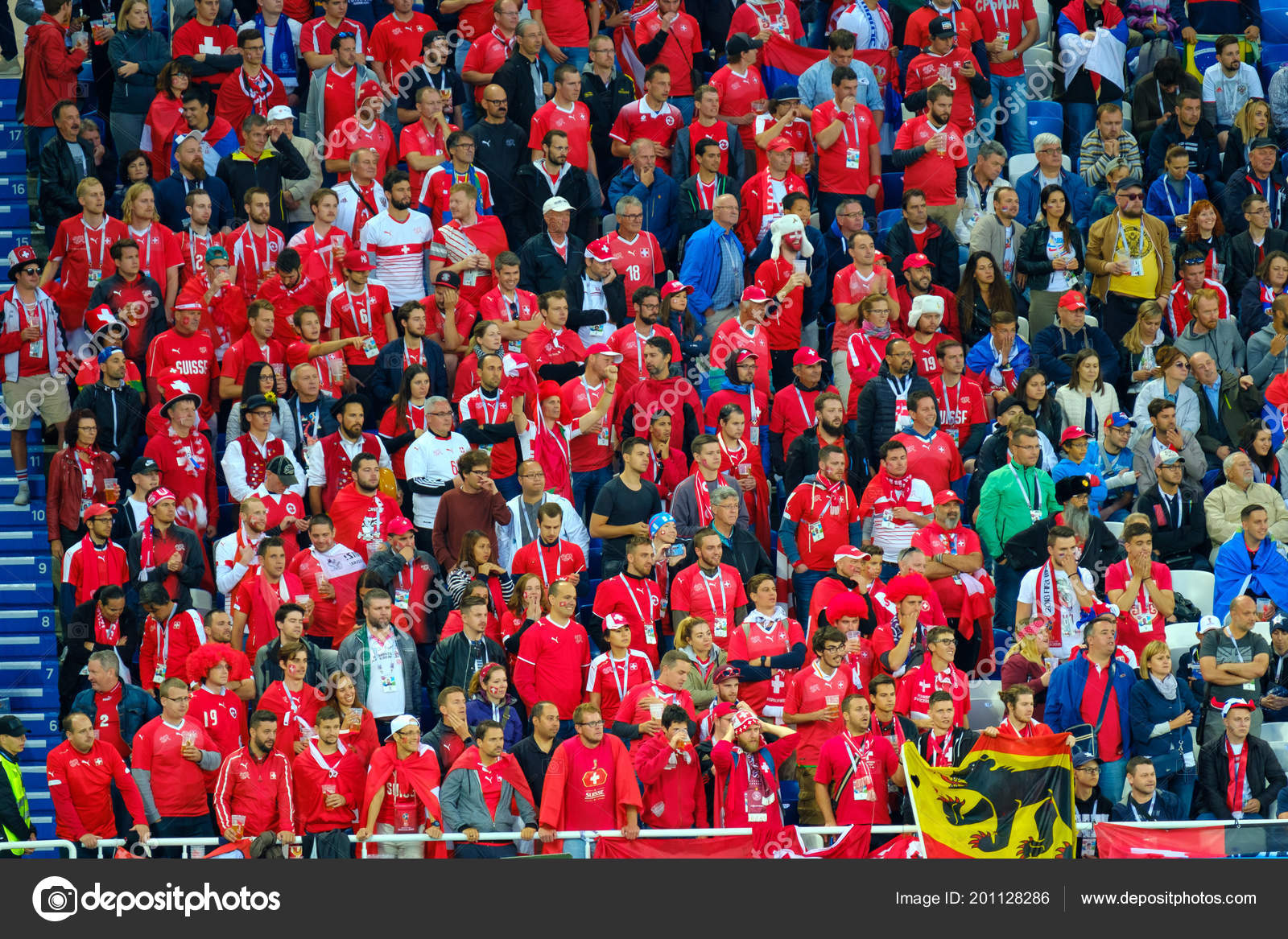 Football fans support teams on the match between Serbia and Switzerland ...