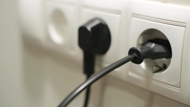 Male hand pulling electrical plugs from sockets — Stock Video © toxawww ...