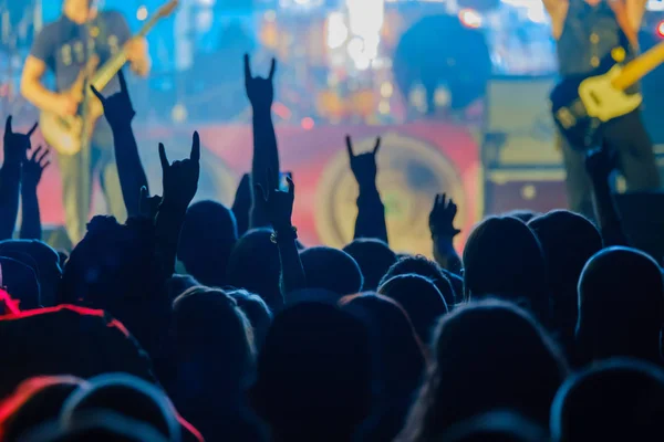Fans cheering musicians on stage at live rock music concert - Stock ...