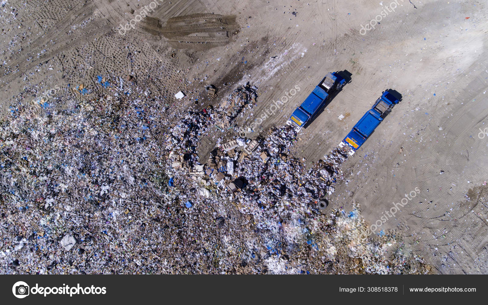 Dumping of trash in a landfill by two trucks Stock Photo by ©txking ...
