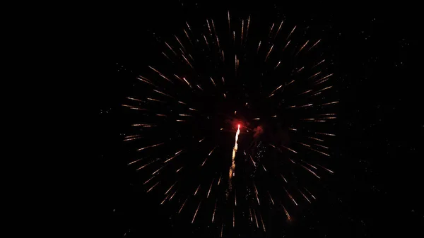 Beautiful red fireworks explosion showing in the night sky - Stock ...