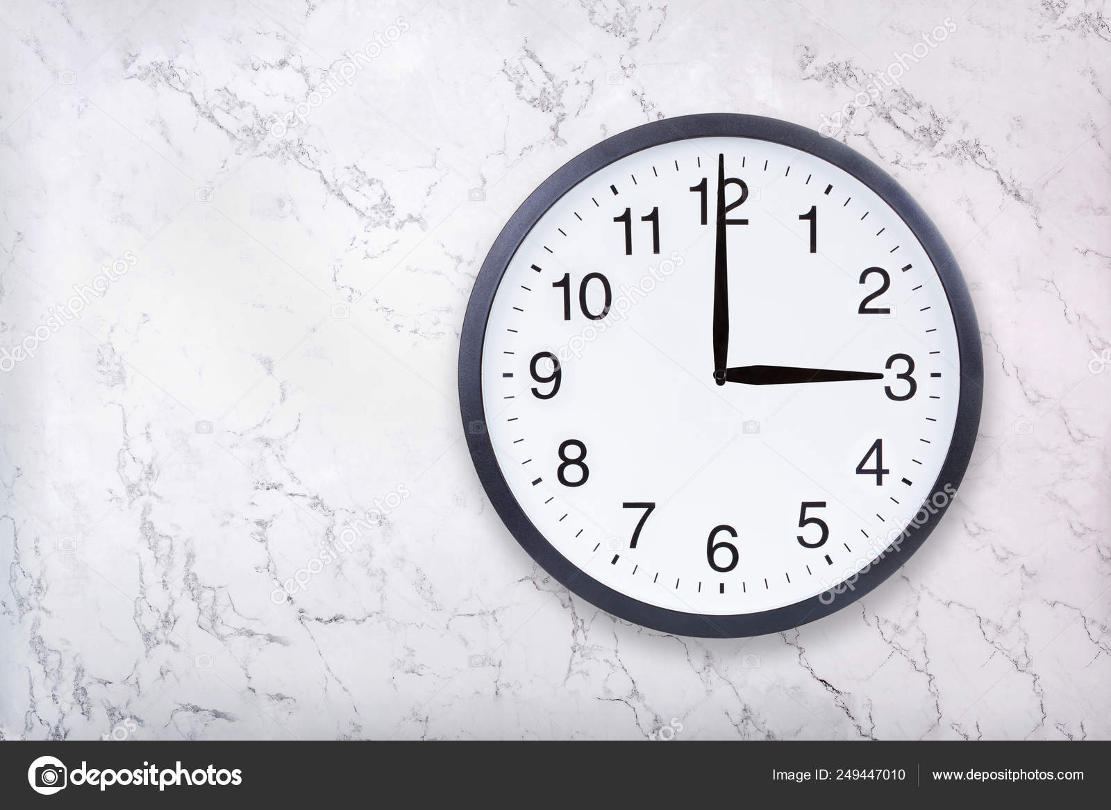 Wall clock show three oclock on white marble texture. Office clock show ...