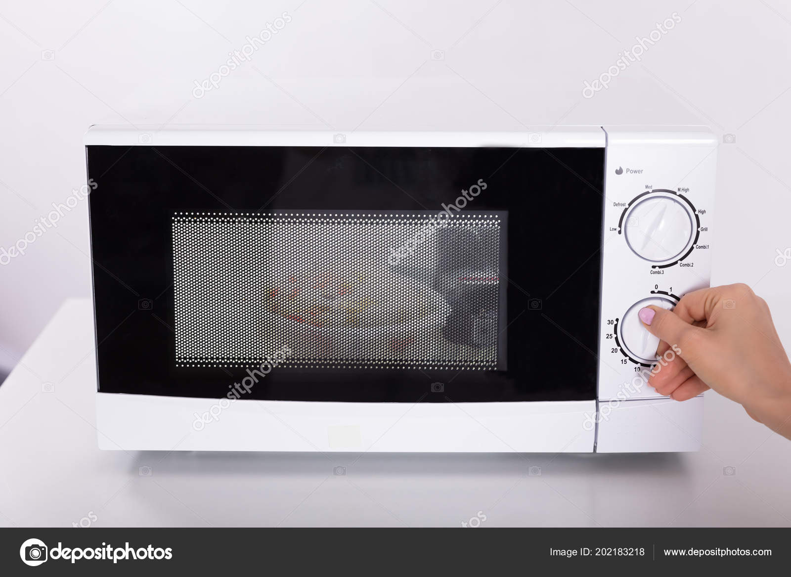 Close Woman's Hand Using Microwave Oven Preparing Food Stock Photo by ...