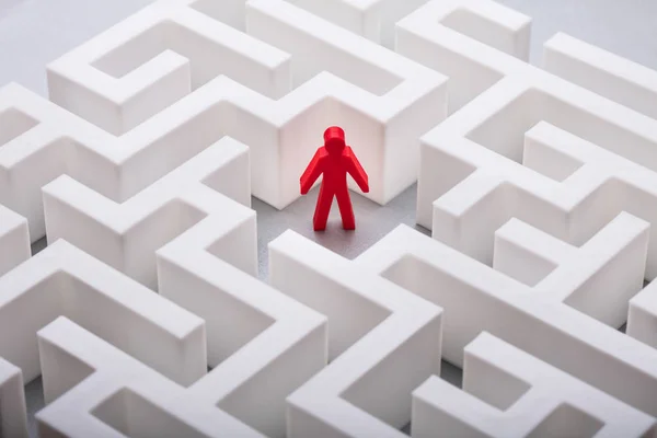 Close-up Of Red Human Figure Standing In The Centre Of White Labyrinth ...