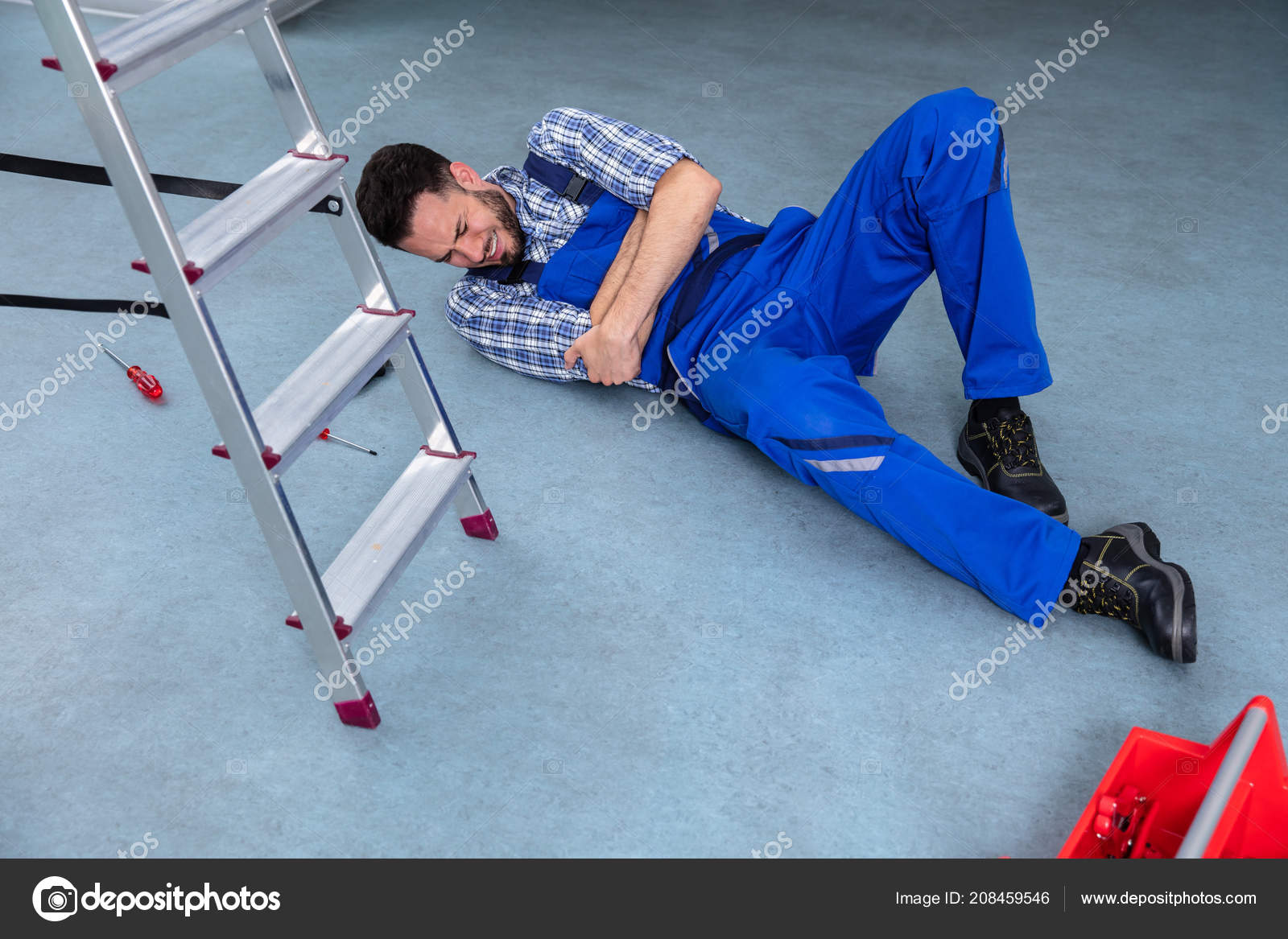 Injured Handyman Lying Floor Falling Ladder Stock Photo by ©AndreyPopov ...