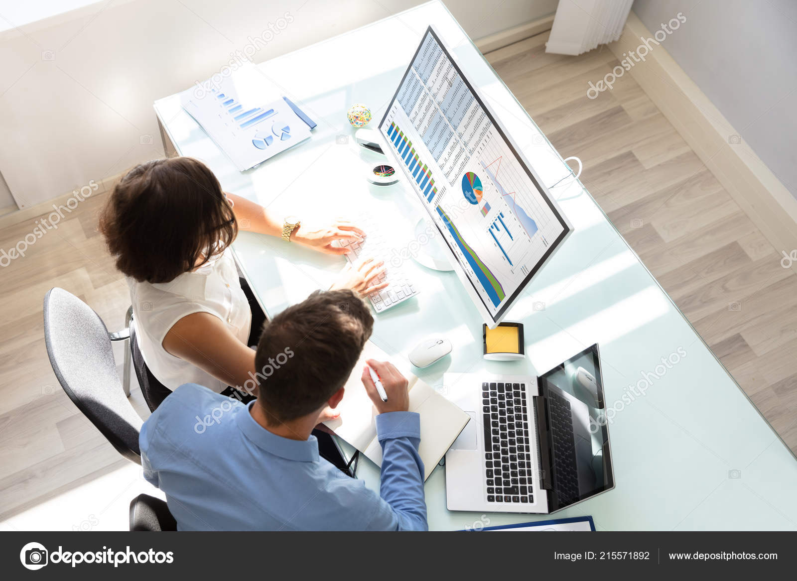 High Angle View Two Businesspeople Analyzing Graphs Computer Workplace ...