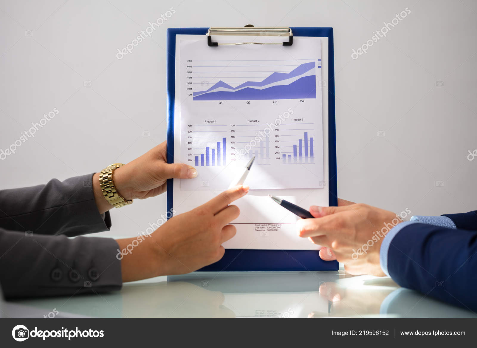Two Businesspeople's Hand Analyzing Graphs Reflective Desk — Stock ...