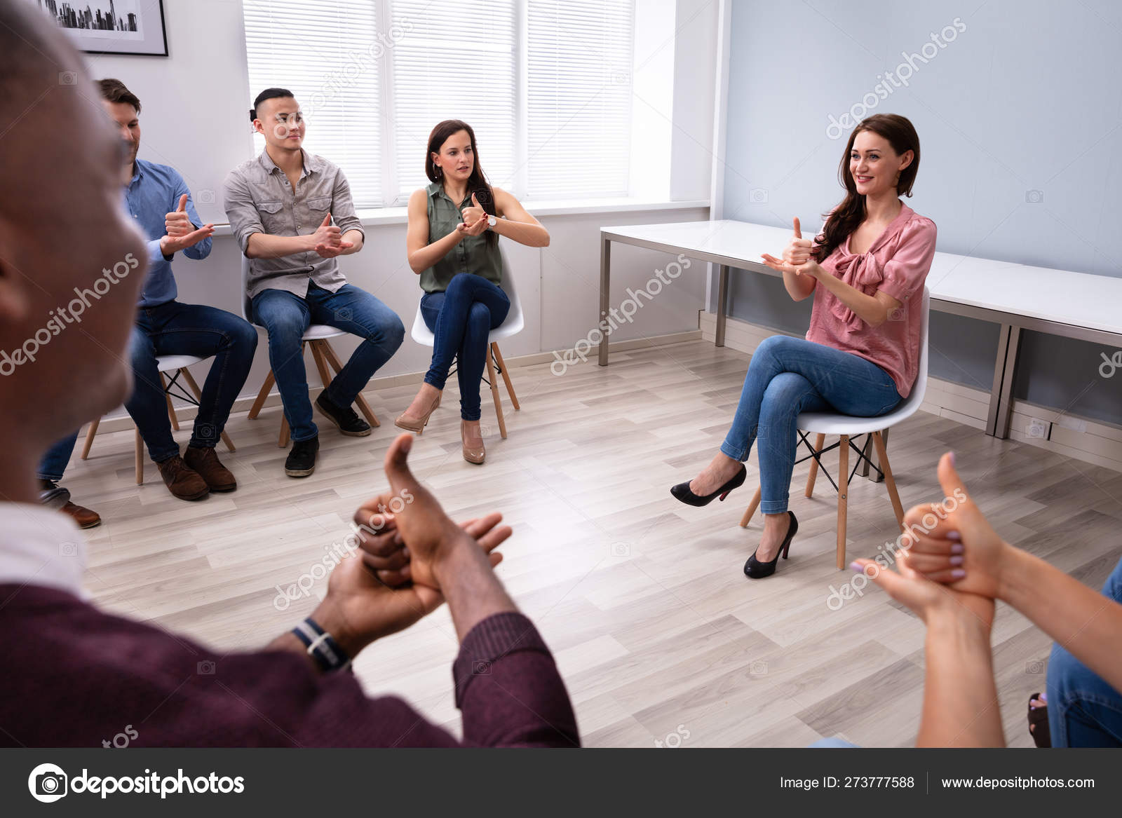 Group Of Deaf People Signing