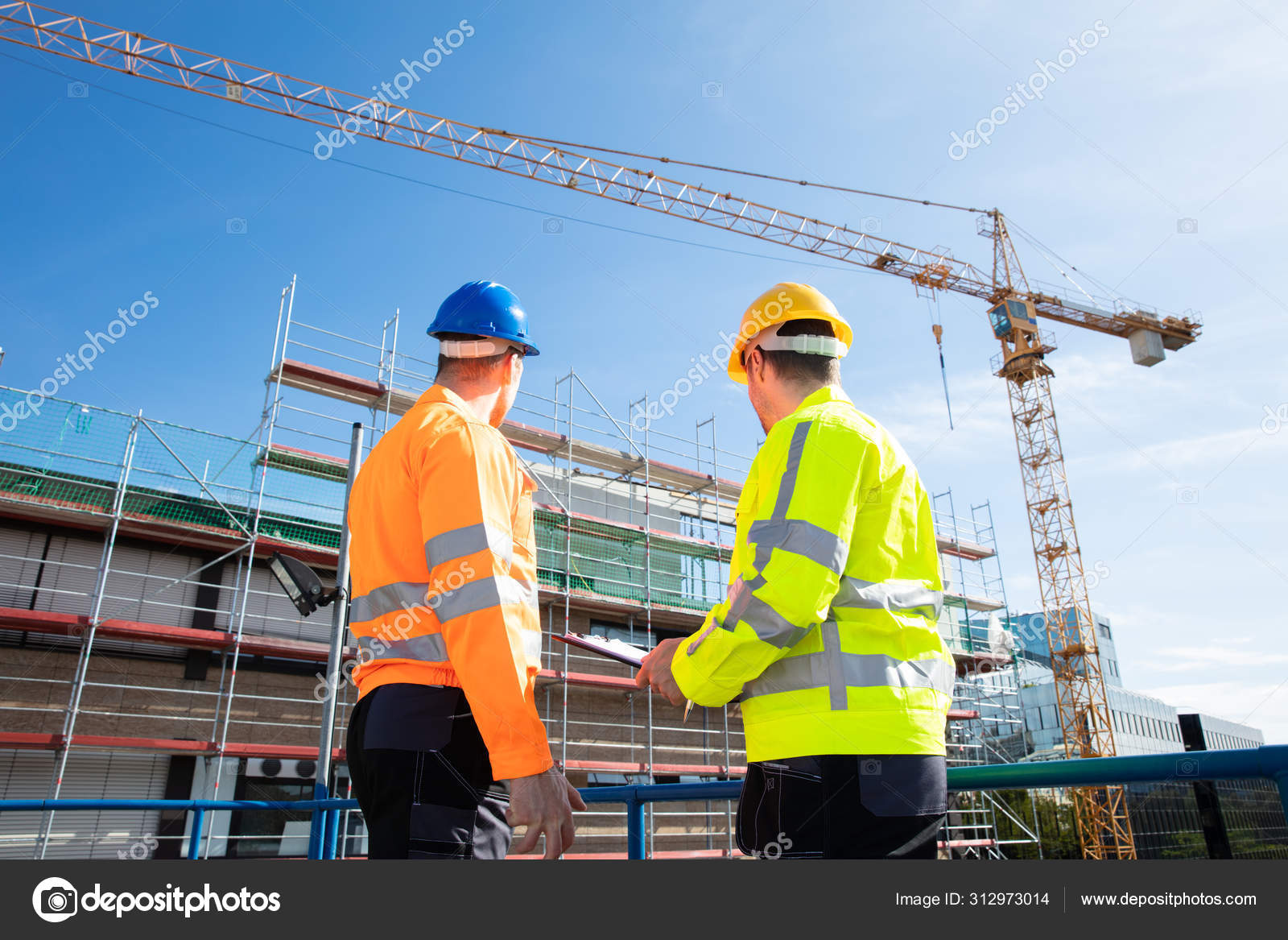 Rear View Two Male Architect Wearing Hardhat Looking Construction Site ...
