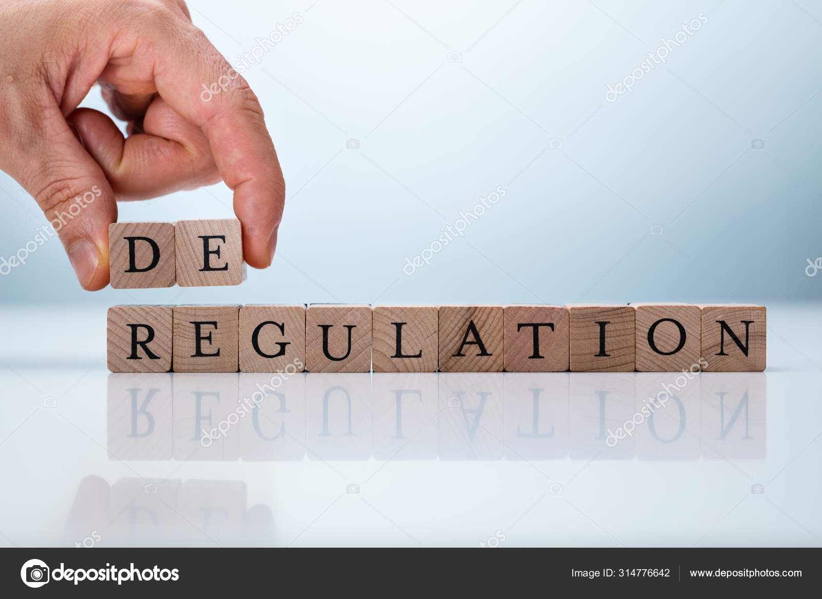 Hand Holding Regulation Word Deregulation Concept Stock Photo by ...