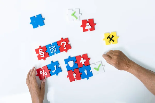 Elder Man Playing Jigsaw Puzzle On Table - Stock Image - Everypixel