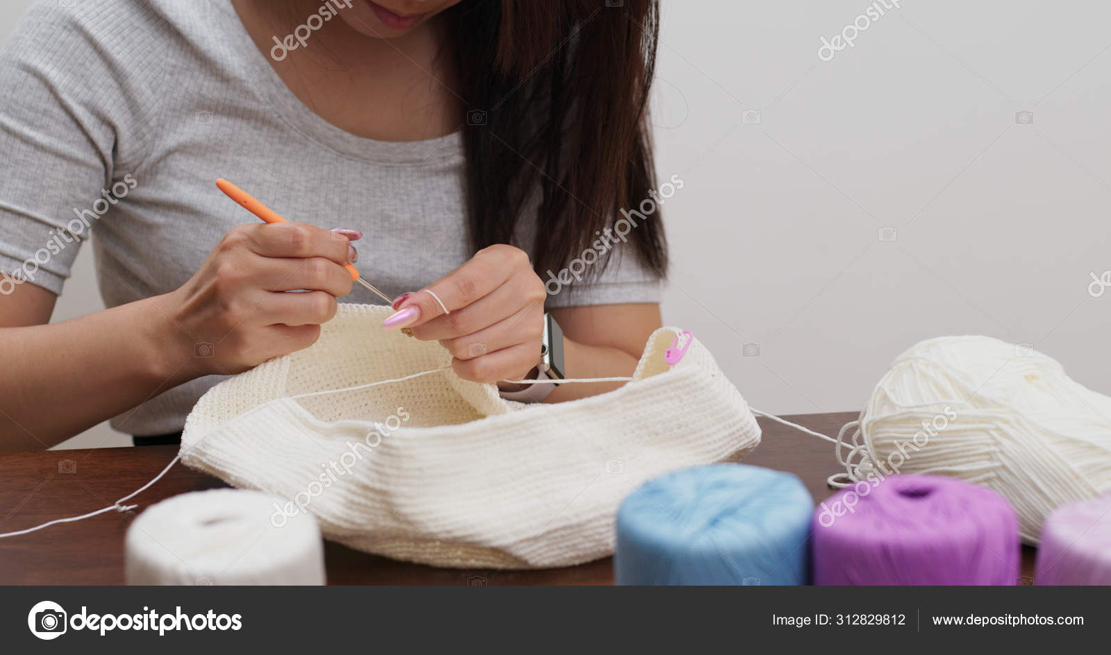 Woman is crocheting with thread at home — Stock Photo © leungchopan ...