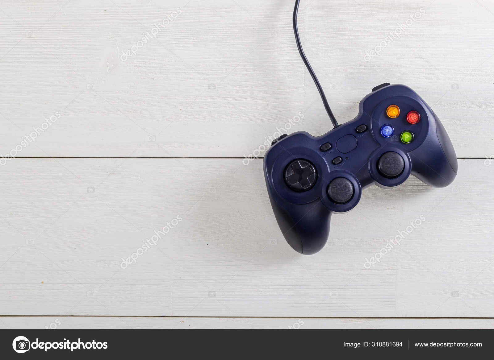 Retro computer gaming controllers placed on wooden background. H Stock ...