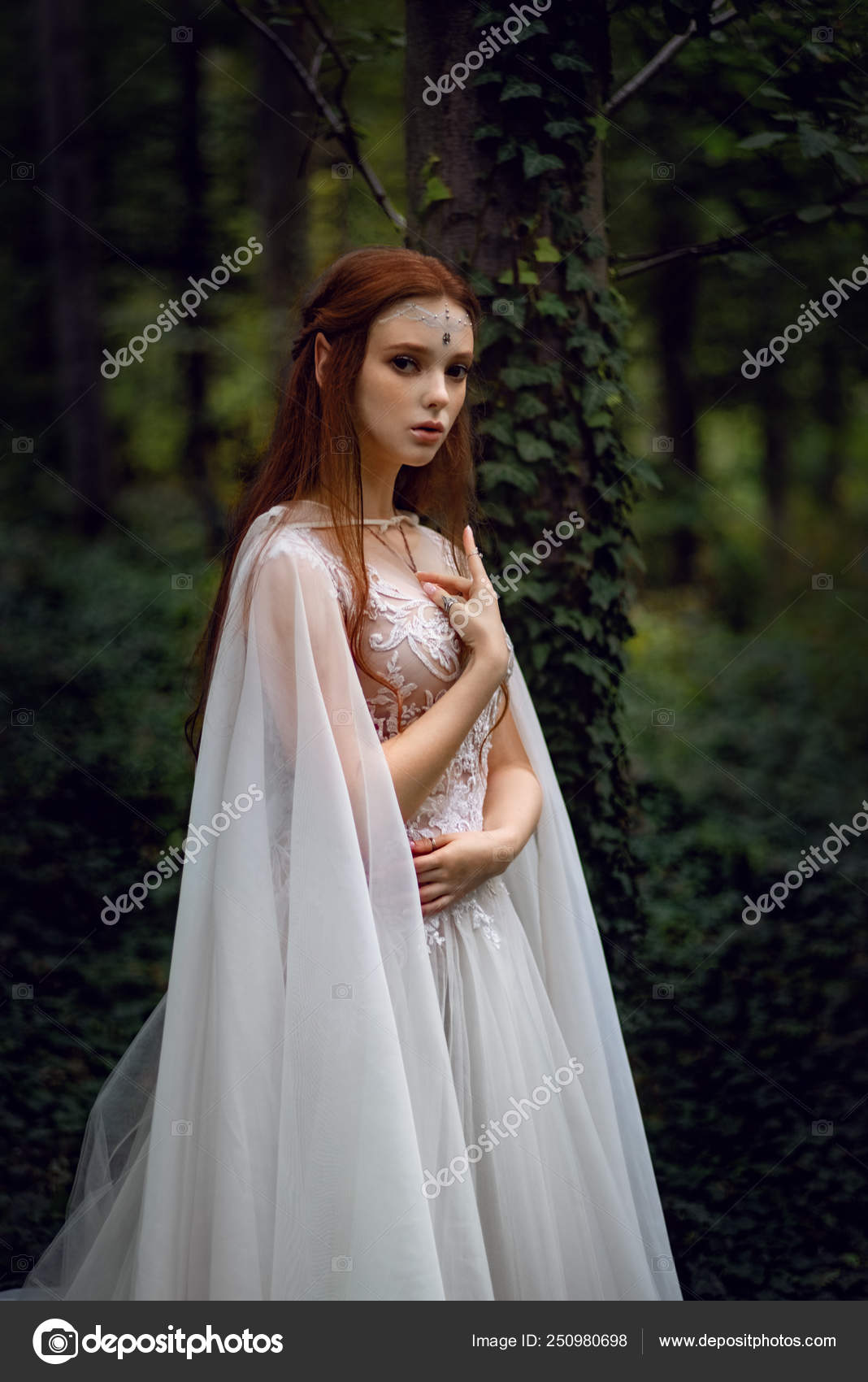 Attractive Ginger Elf Woman White Dress Cape Posing Green Garden Stock ...