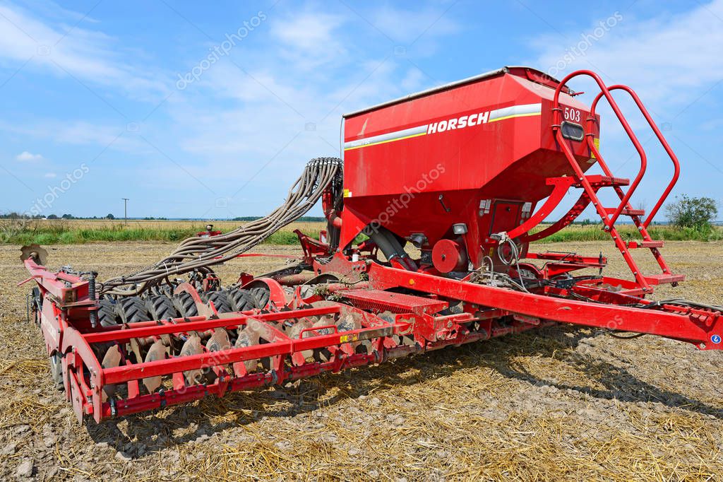 Kalush, Ukraine - August 10 : Modern John Deere tractor with a planter ...