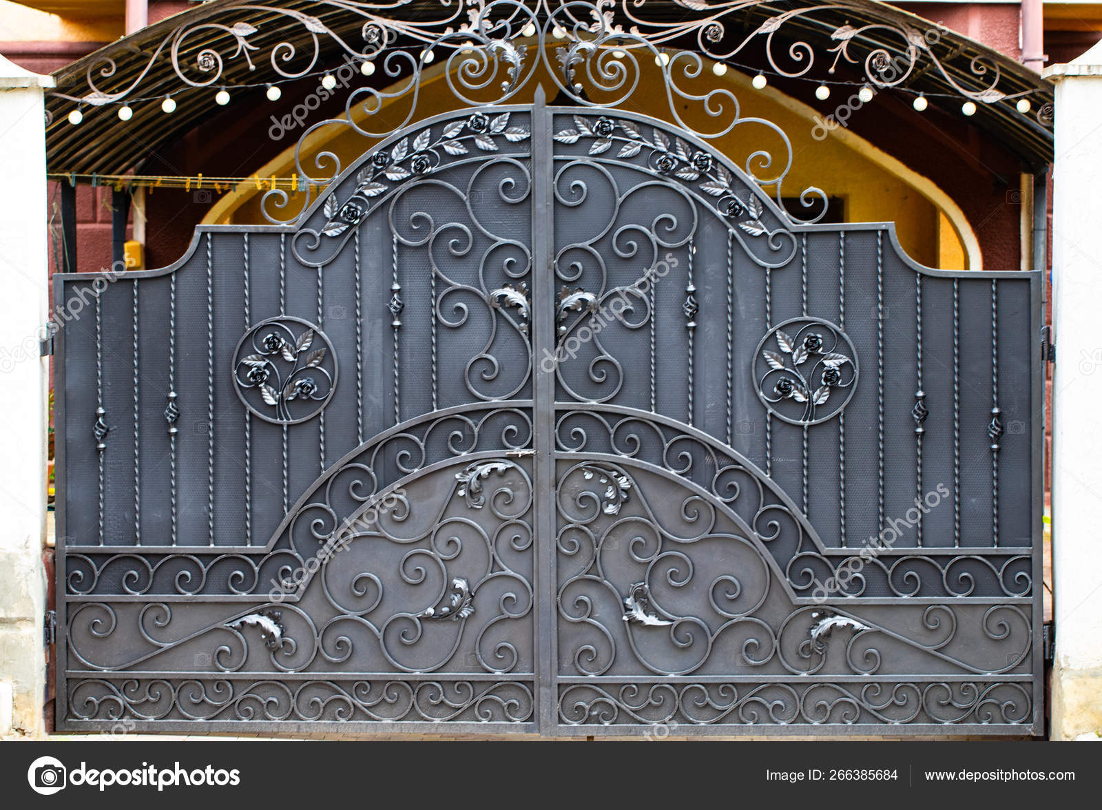 Wrought-iron gates, ornamental forging, forged elements close-up ...