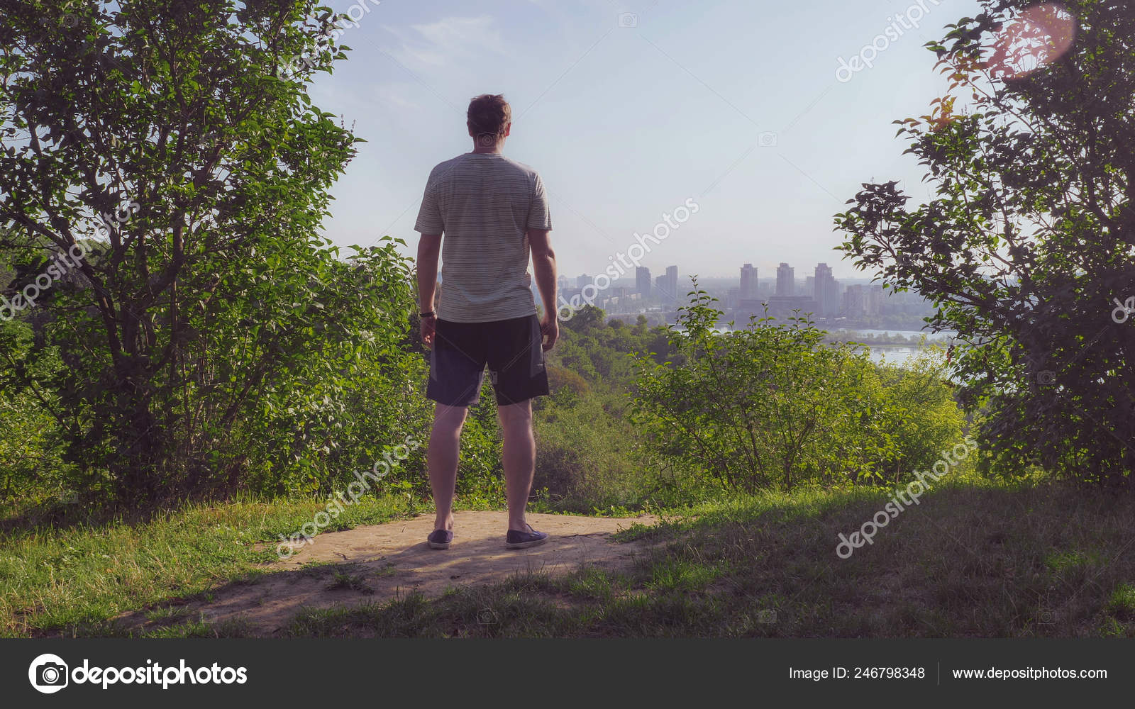 Guy looks on urban landscape from the top. Stock Photo by ©loginovVados ...