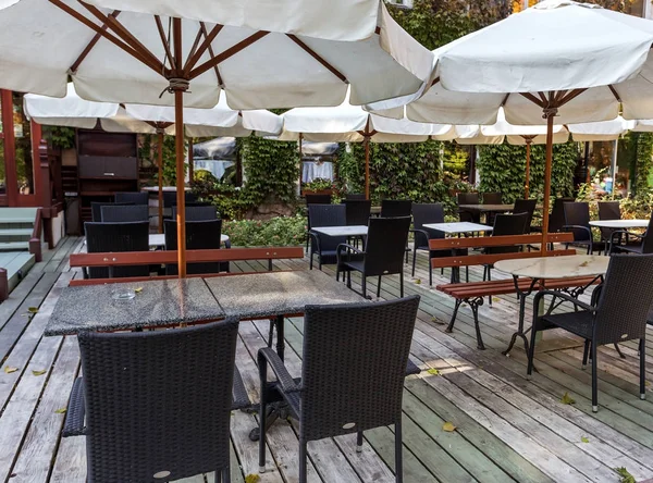 Typical summer outdoor cafe. Tables and chairs poroschadki summer cafe ...